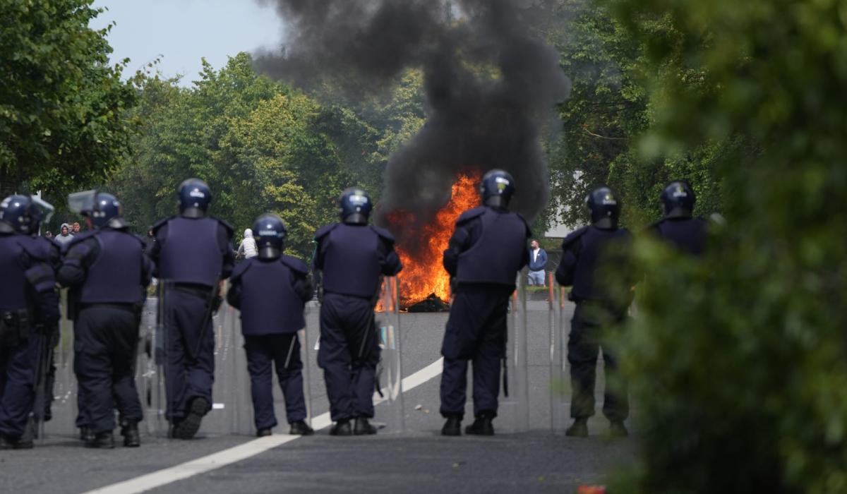 Garda hospitalised and man (20s) arrested at Coolock protest as rocks ...